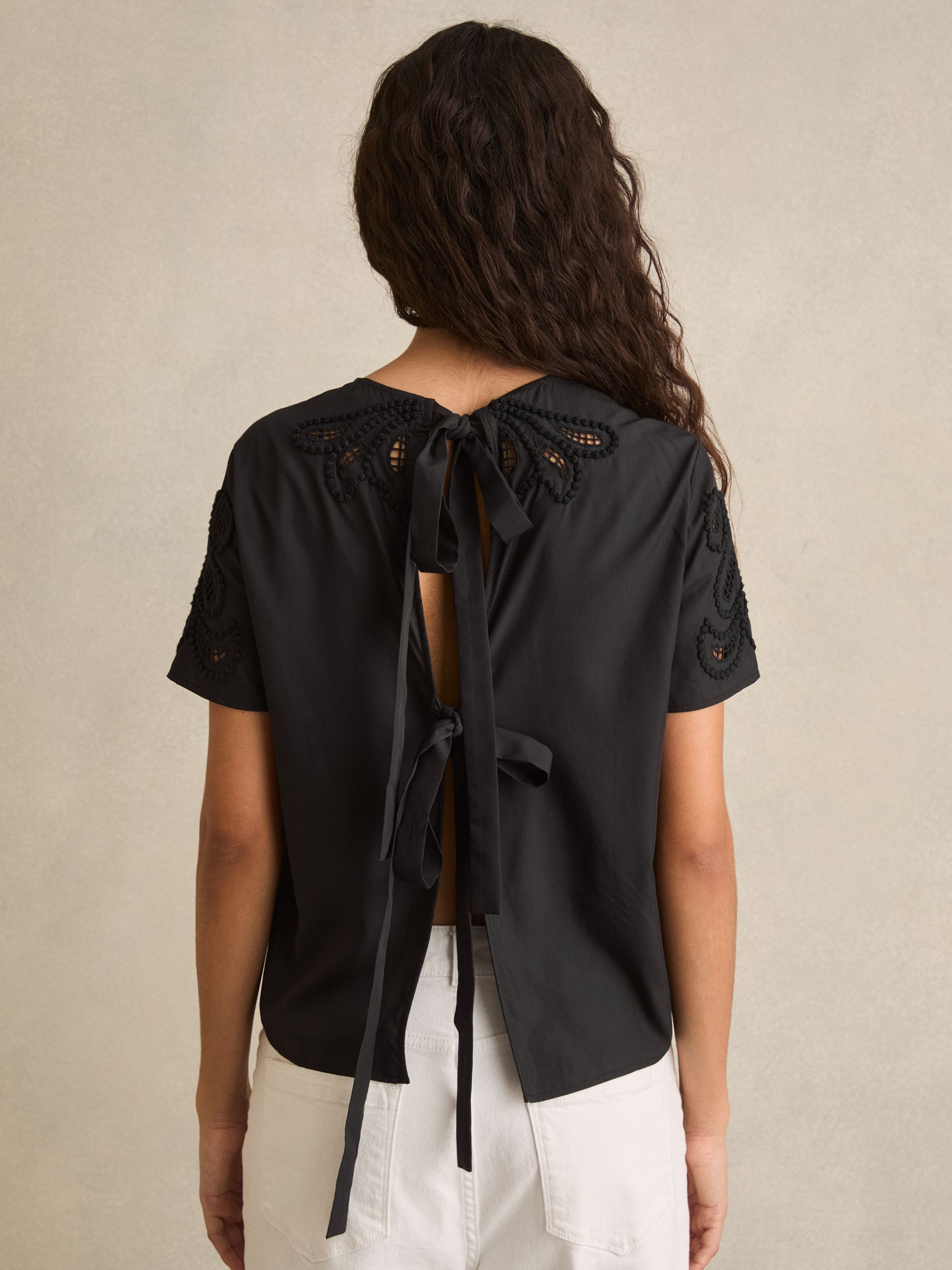 Reiss Floral Cut-Out Embroidery Top in Black | REISS