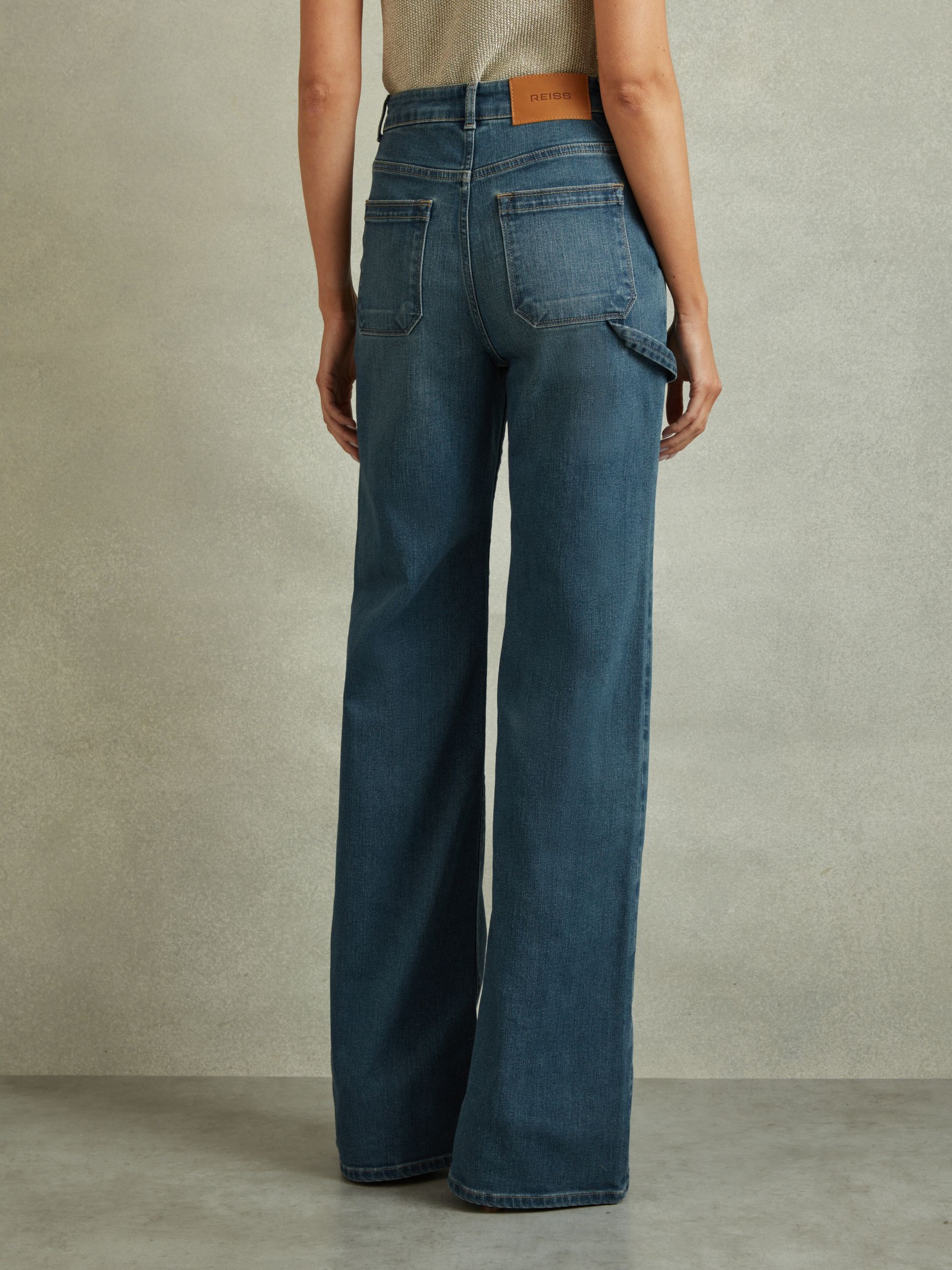 Reiss Petite Mid Rise Flared Utility Jeans in Mid Blue - REISS