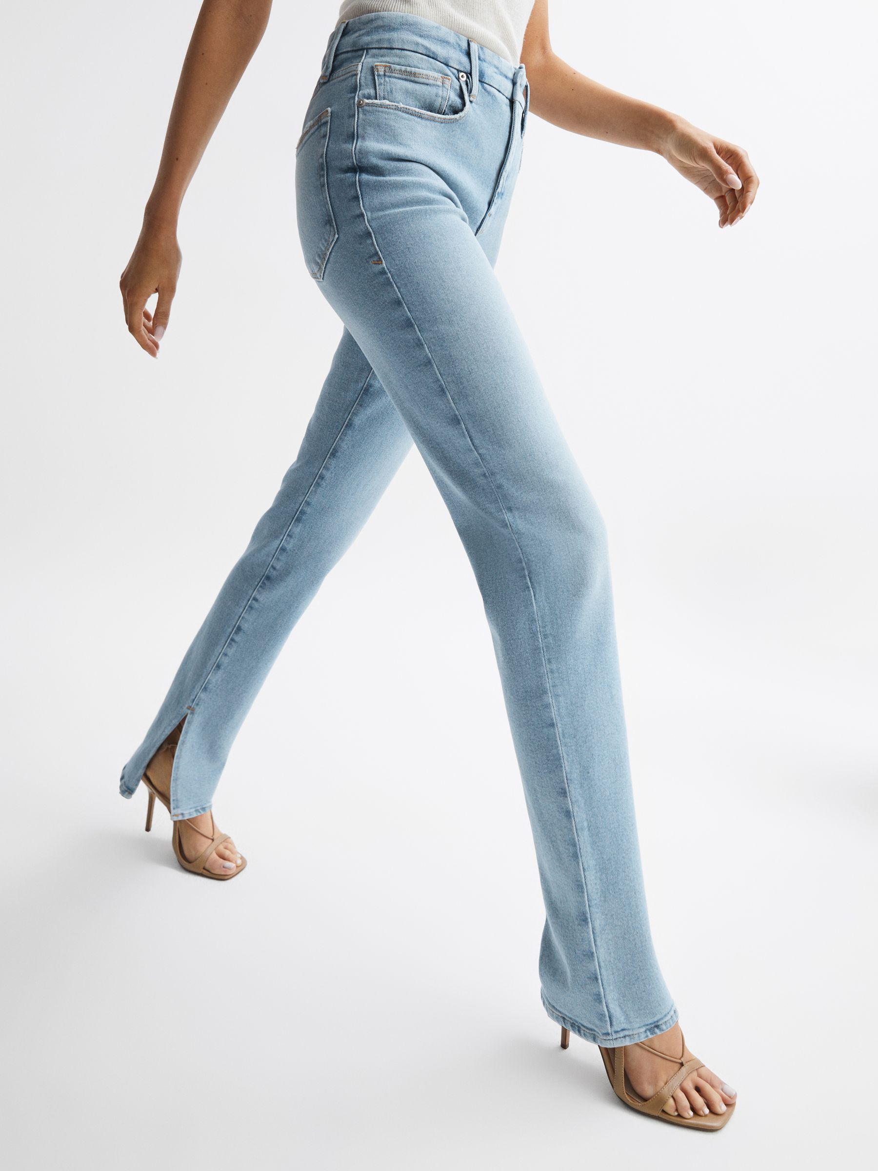Good American High Rise Inseam Split Jeans in Mid Blue - REISS